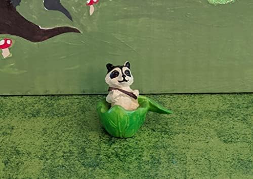 Mapache miniatura remando una hoja barco jardín miniatura jardín – Yaxa ...