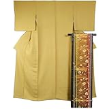 ・ブランド:ノーブランド品・商品 説明 干割れ模様の地織が施された正絹地を薄い明るめの芥子色系に染め上げた色無地と、金・銅色系ぼかしの地に縞に唐花模様が織られた袋帯の２点セットです。 お着物に家紋は入っておりません。 帯は西陣高島織物謹製、...