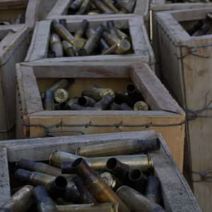 Amazon.com: Spent 50-caliber machine gun shell casings sit inside ...