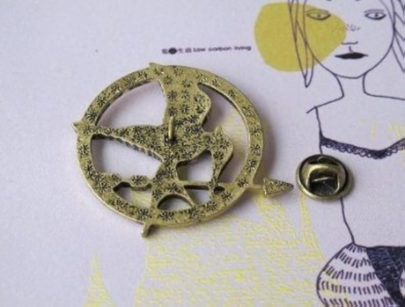 Spilla Mockingjay Su Katniss