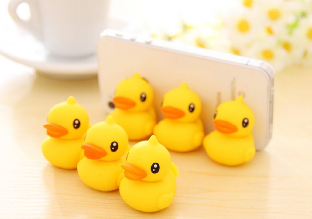 Cute little yellow duck stereo bed lounger Apple phone octopus sucker ...