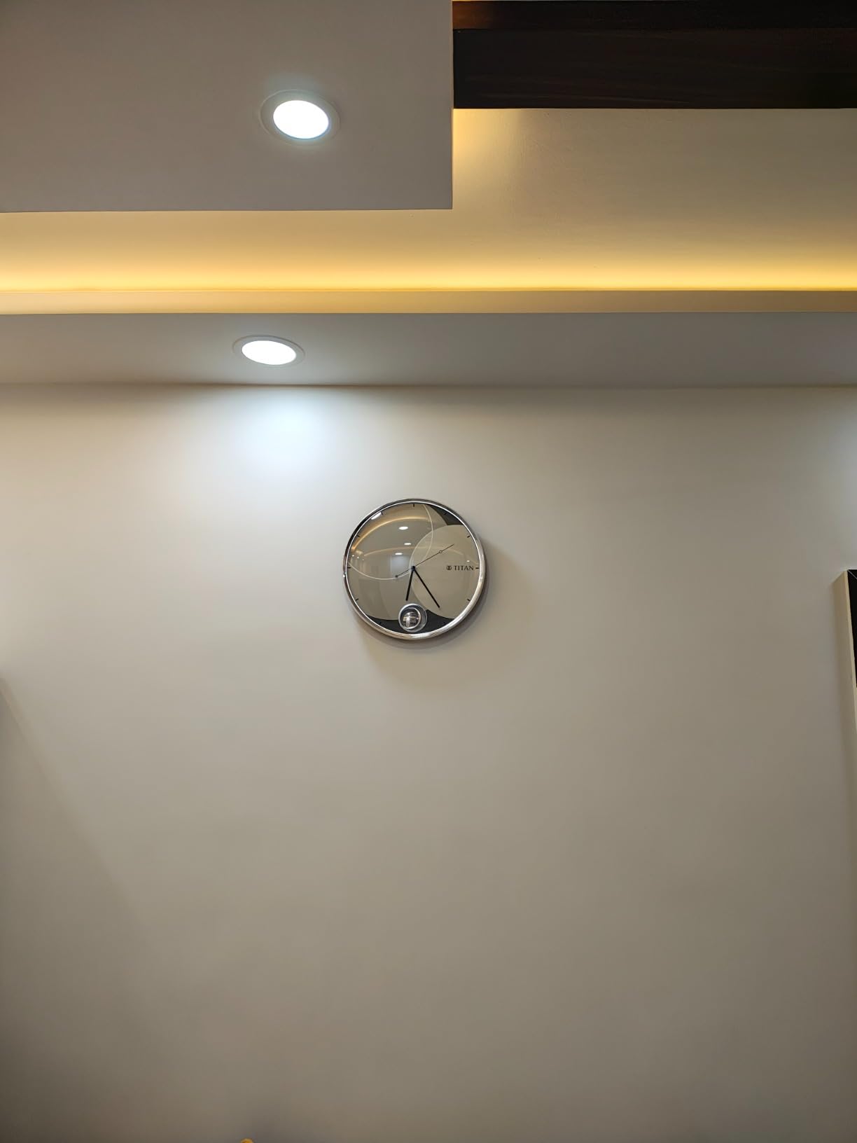 Titan Contemporary Round Pendulum Clock with a Metallic Finish and ...