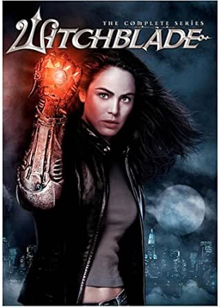 Witchblade Yancy Butler as Det. Sara Standing One Arm Raised Looking ...