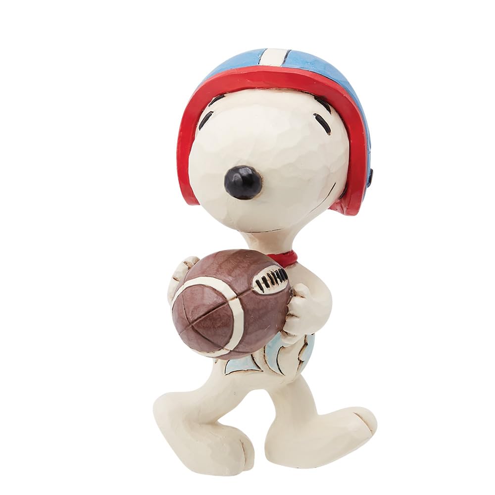 Amazon.com: Enesco Peanuts by Jim Shore Snoopy Holding Football ...
