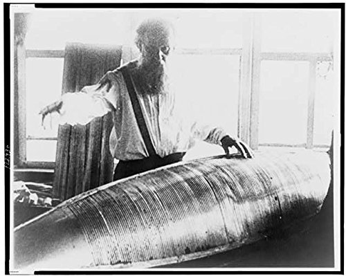 Photo: Konstantin Tsiolkovsky,looking down at model of an early Russian ...