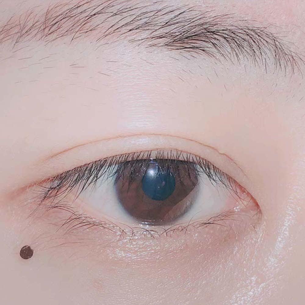 Facial Mole Tattoos