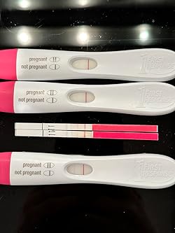 Holding Positive Pregnancy Test First Response