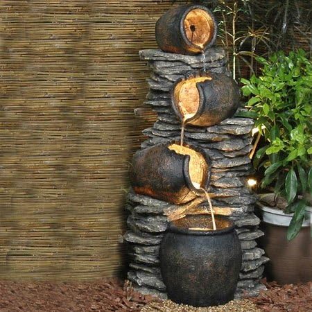 4 pots on a rock water feature : Amazon.co.uk: Garden