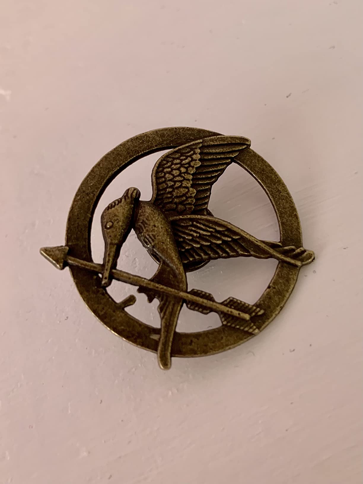 Amazon.com: The Hunger Games Movie Mockingjay Prop Rep Pin : Toys & Games