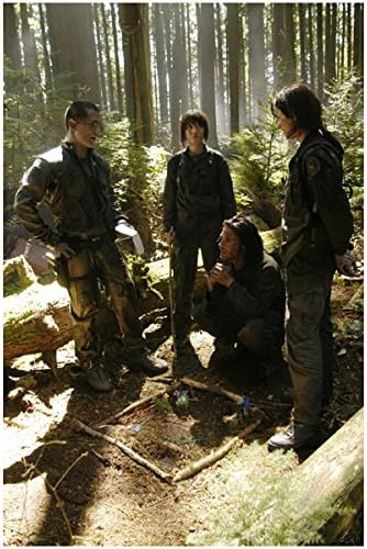 Gaius Baltar and Cally Henderson with others in forest on Kobol ...
