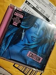 Caution: Amazon.com.mx: Música