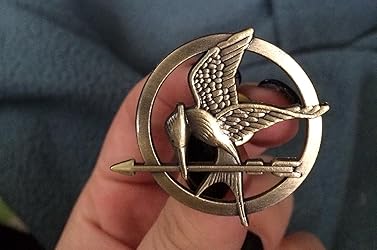 Amazon.com: The Hunger Games Movie Mockingjay Prop Rep Pin : Clothing ...