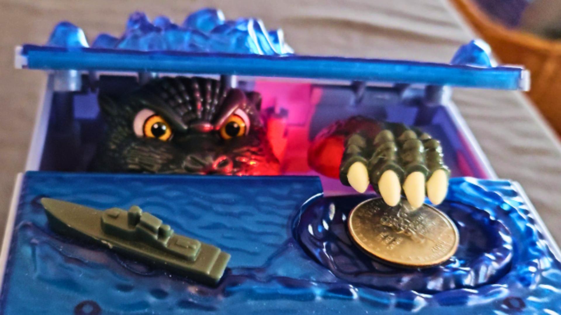 Watch You've Never Seen a Piggy Bank Like It | Godzilla Coin-Stealing ...