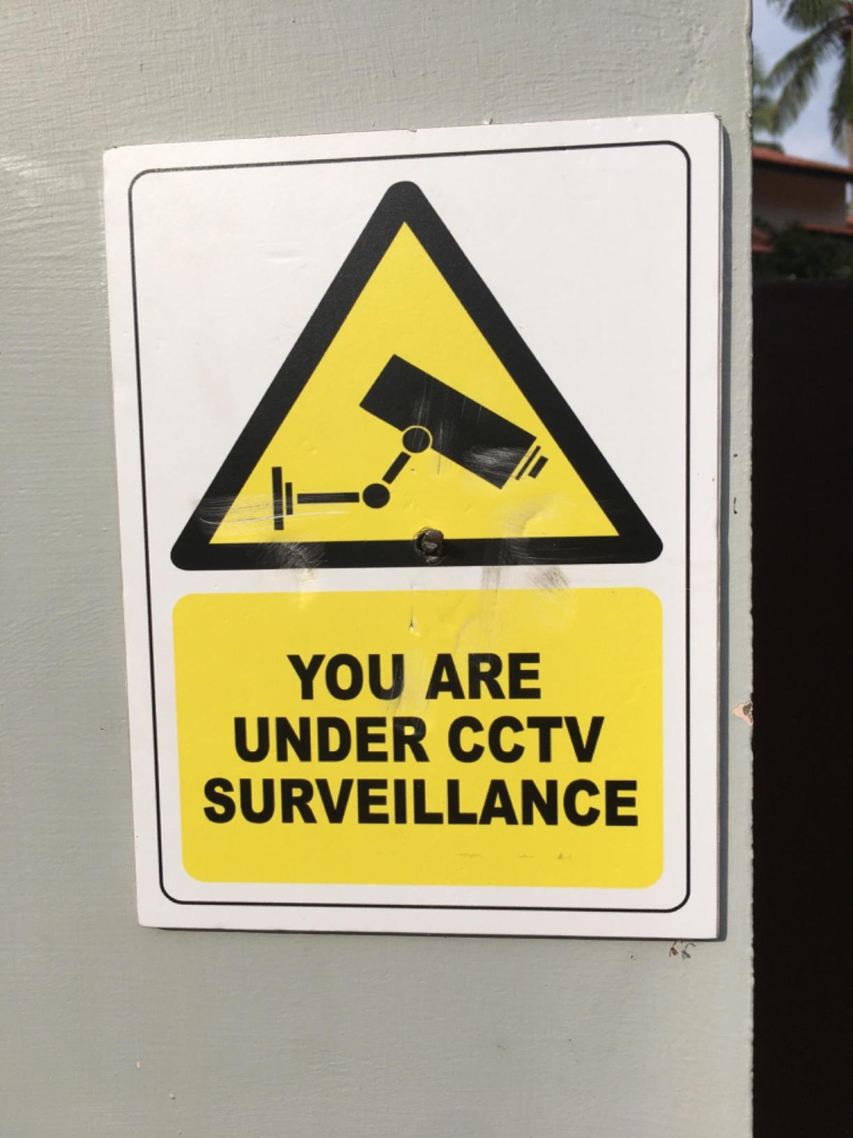 999Store under surveillance camera sign office supplies sunboard You ...