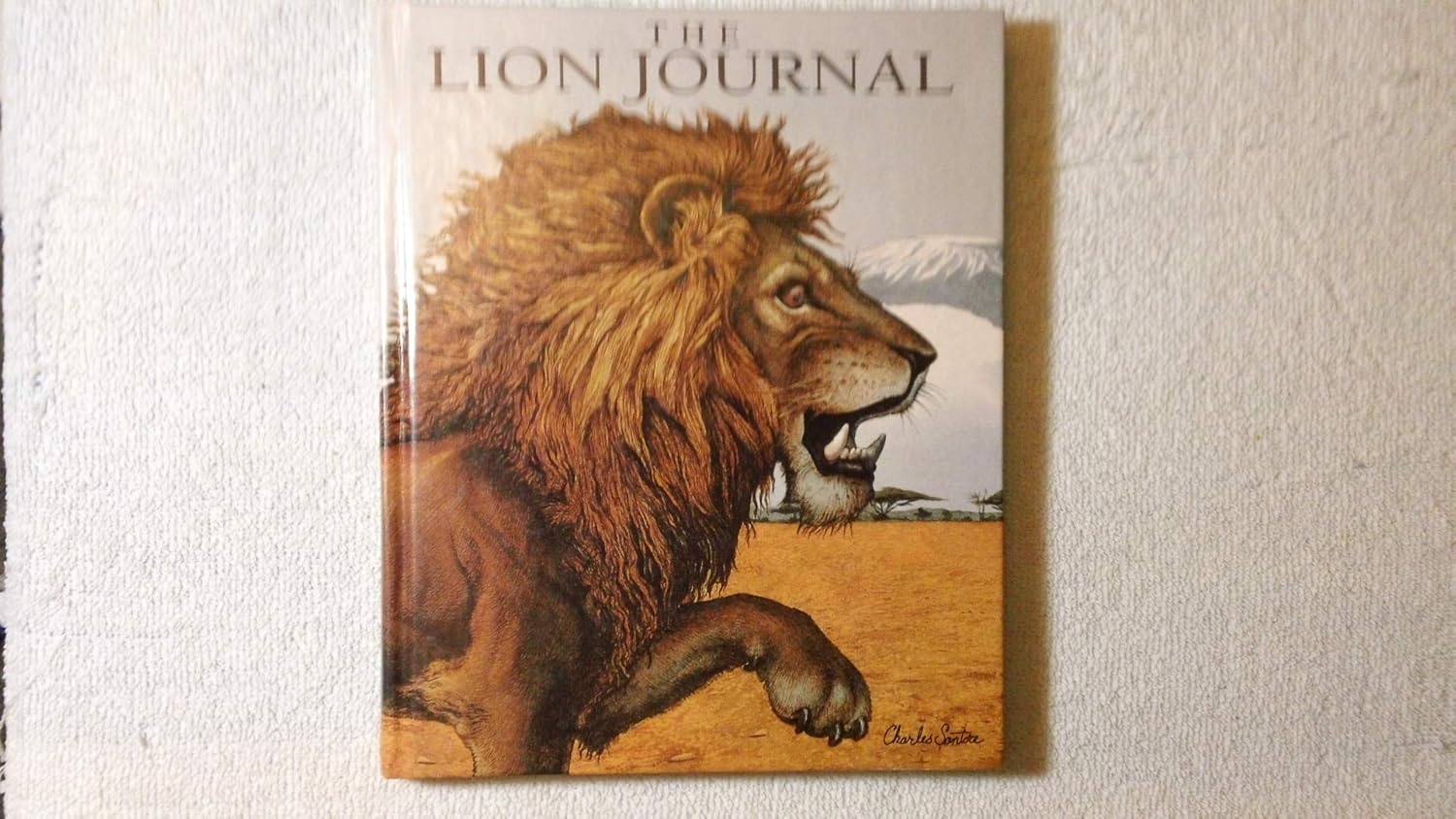 The Lion Journal: Santore, Charles: 9780517123171: Amazon.com: Books