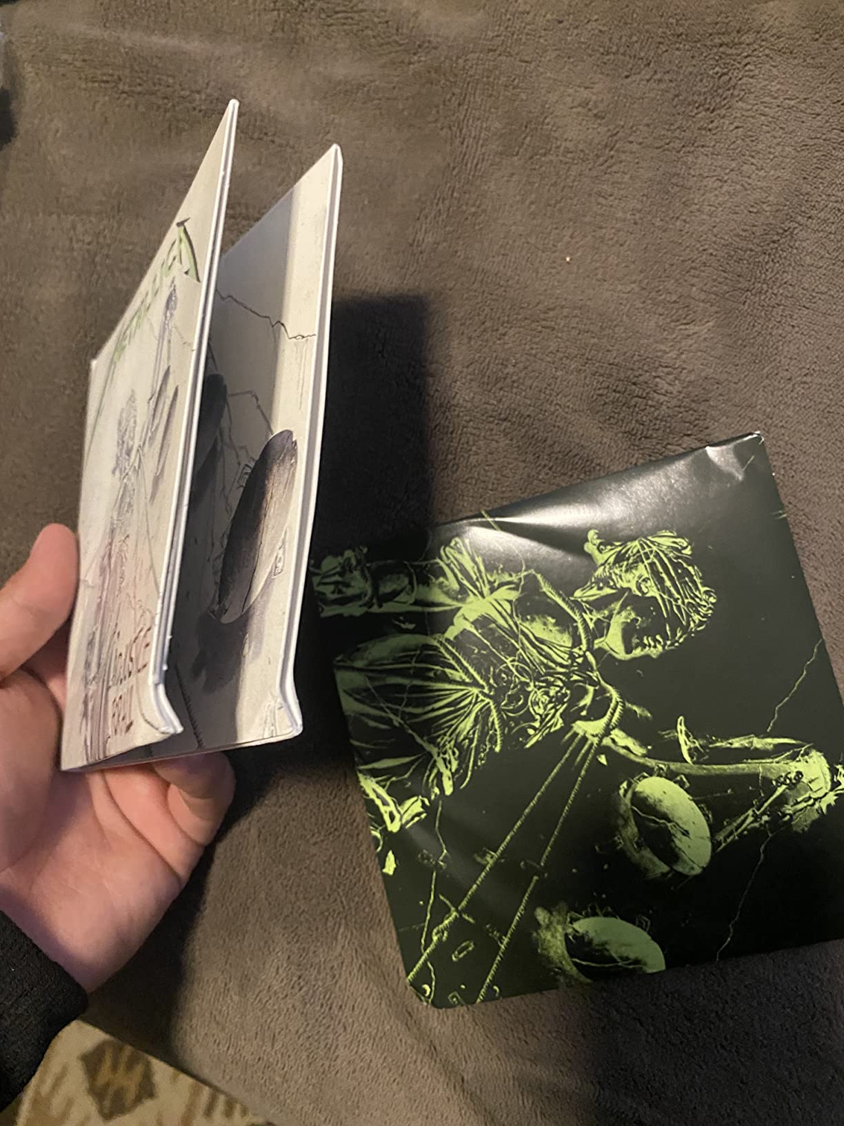 Which and justice for all CD case is plastic and wich is the paper like ...