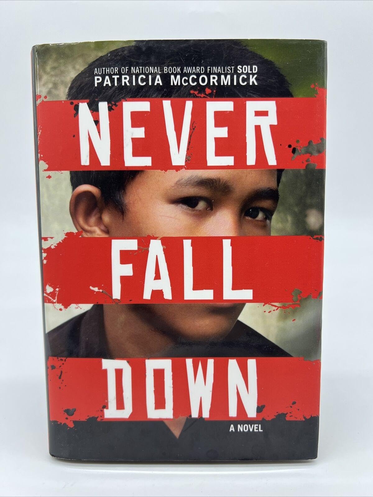 Amazon.com: Never Fall Down: 9780061730931: McCormick, Patricia: Books