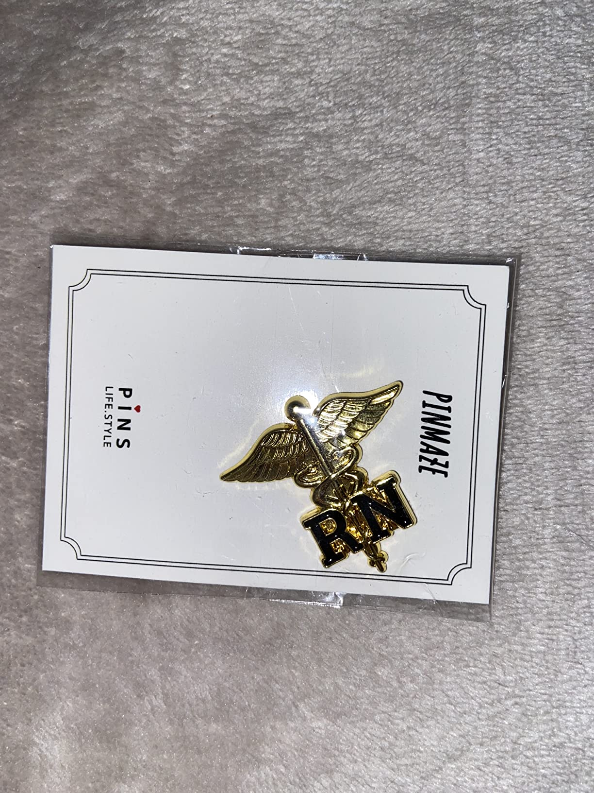 Amazon.com: Registered Nurse Emblem Lapel Pin - Letters on Caduceus ...
