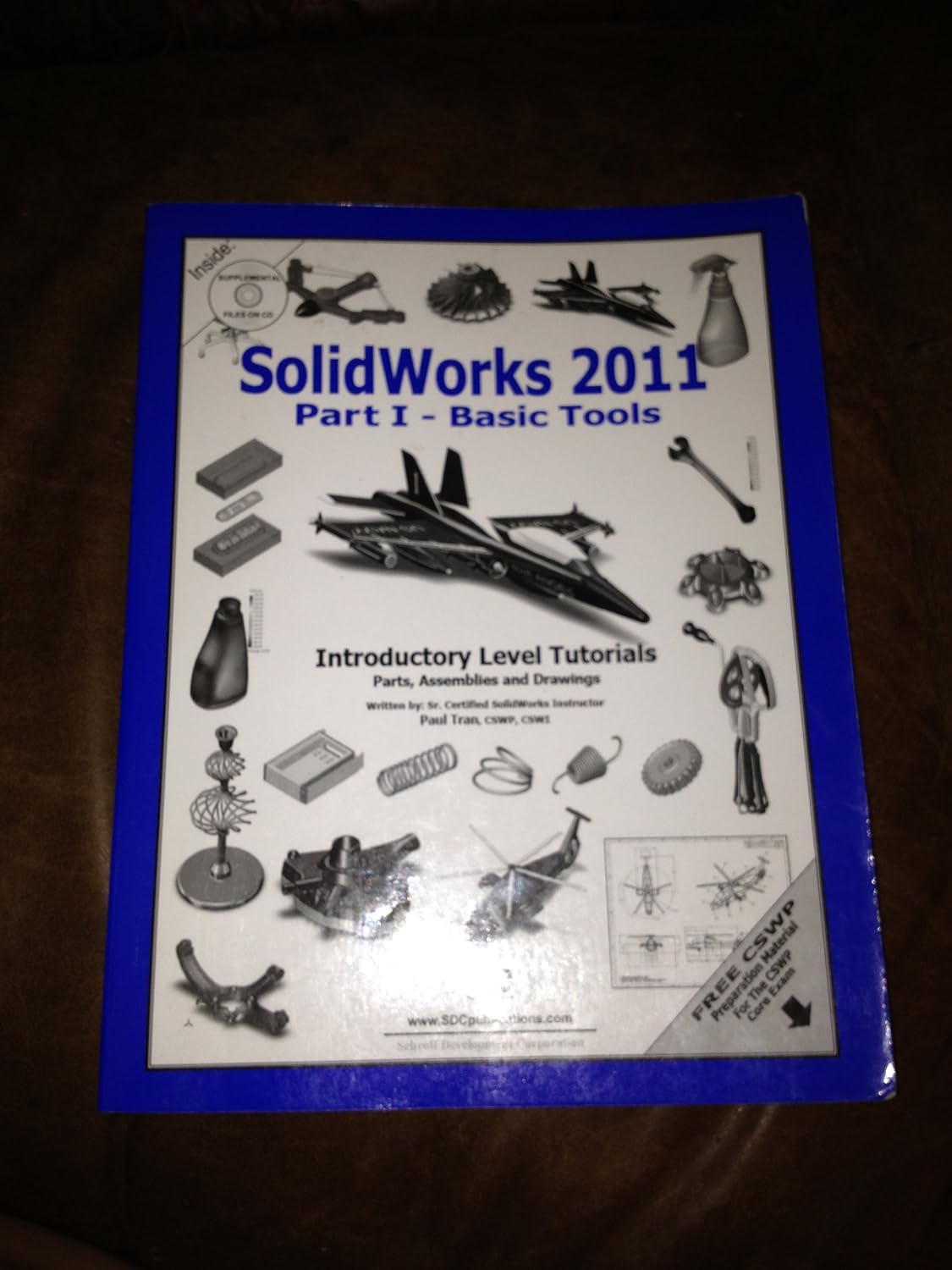 SolidWorks 2011 Part I - Basic Tools: Paul Tran: 9781585036240: Amazon ...
