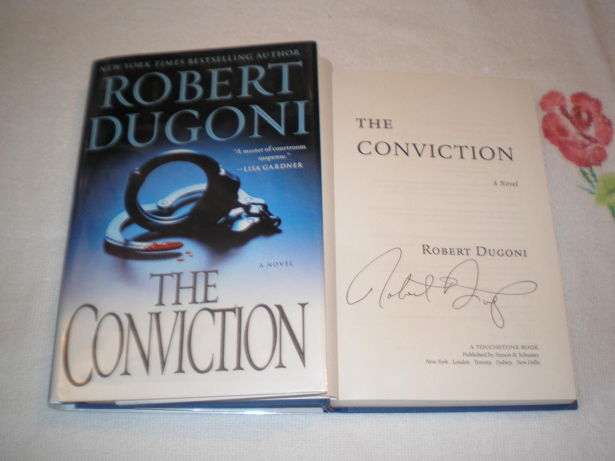 Amazon.com: The Conviction: A Novel: 9781451606720: Dugoni, Robert: Books