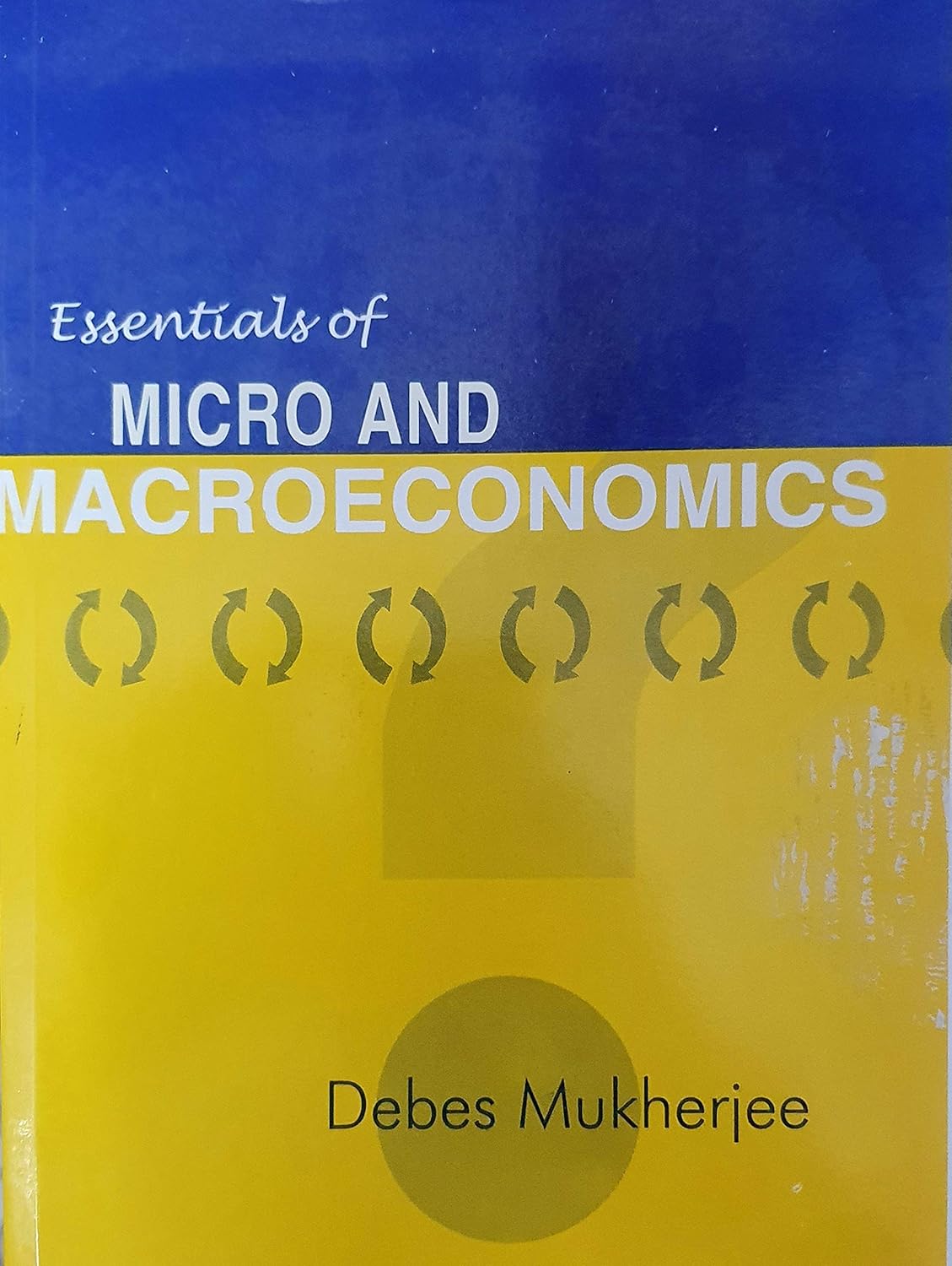 Essentials of Micro and Macroeconomics: Mukherjee: 9788173814679 ...