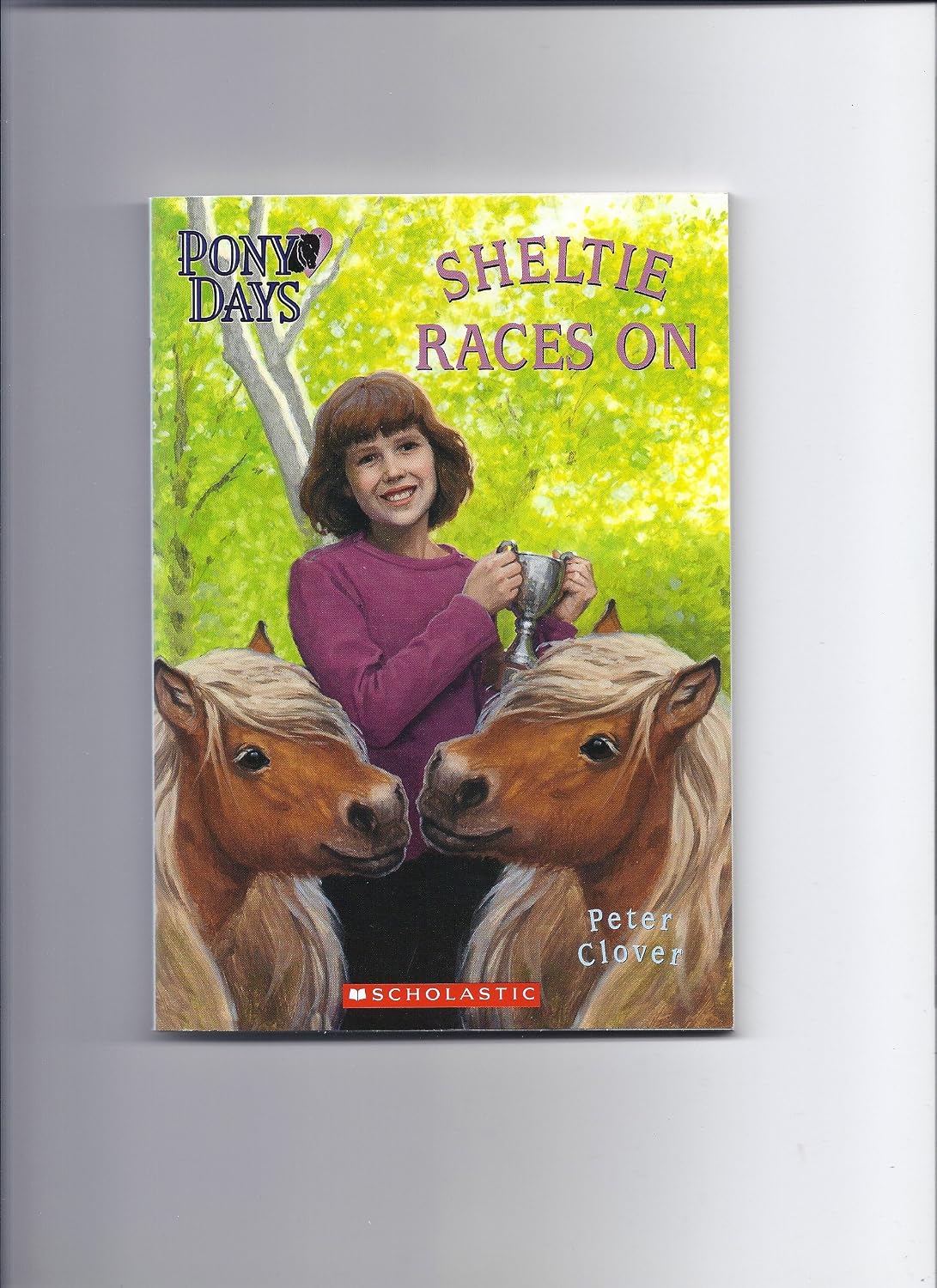 Sheltie Races On (Pony Days): Peter Clover: 9780439801546: Amazon.com ...