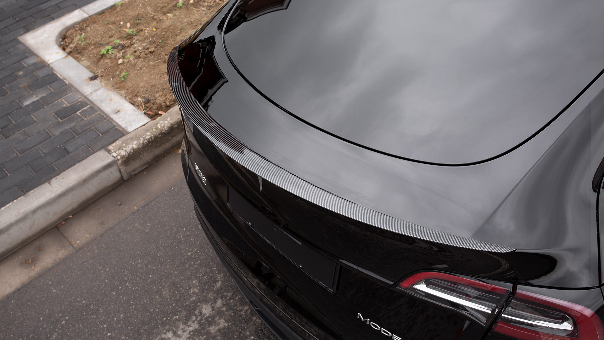 Watch Tesla model y performance spoiler installation video on Amazon Live