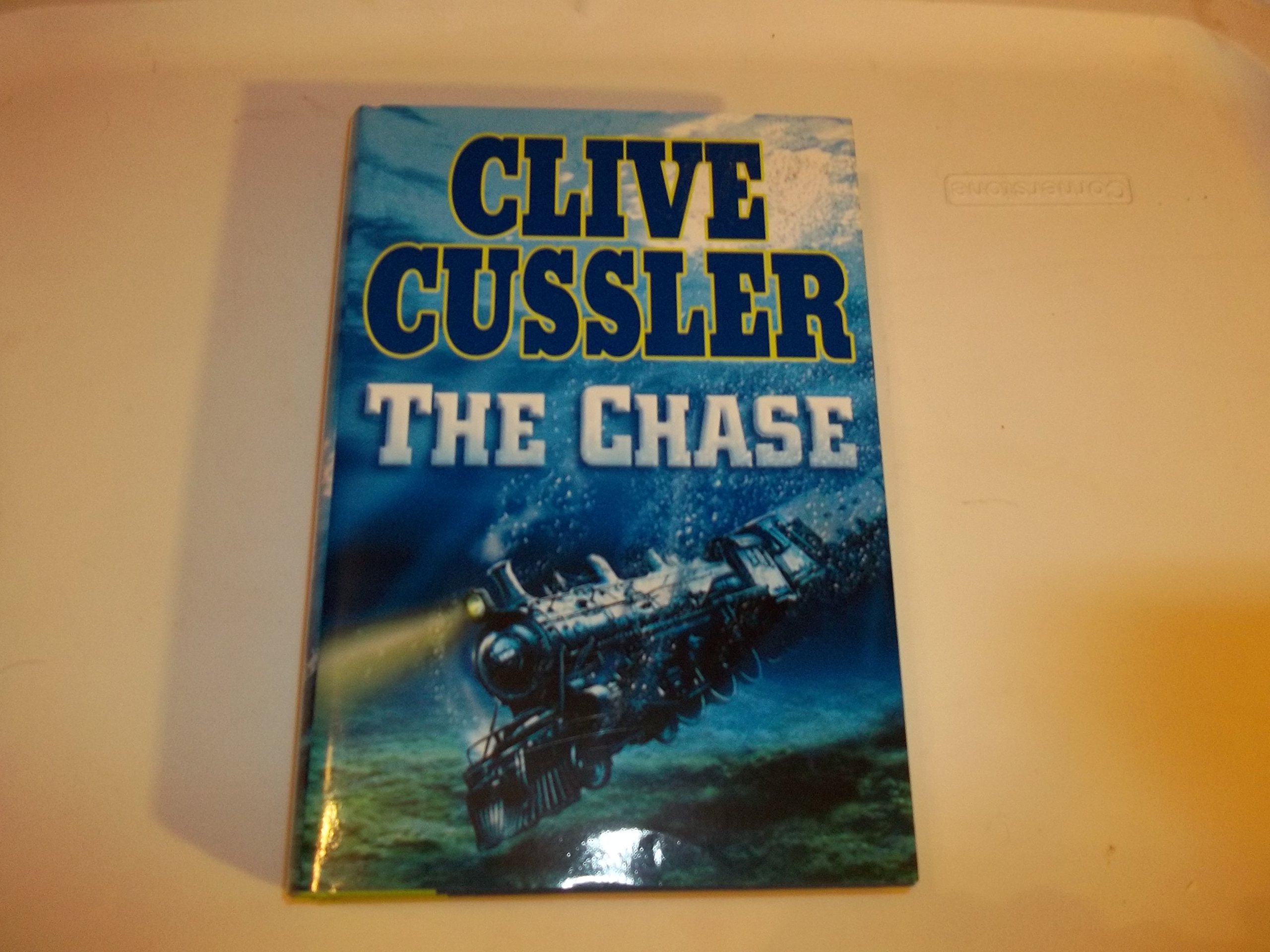 Amazon.com: The Chase (An Isaac Bell Adventure): 9780399154386: Cussler ...