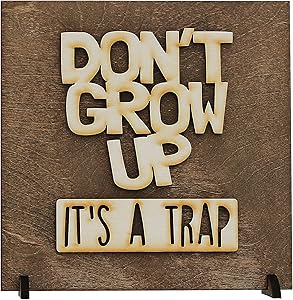 Amazon.com: MannMade Designs Don't Grow Up It's A Trap Wood Sign : Home ...