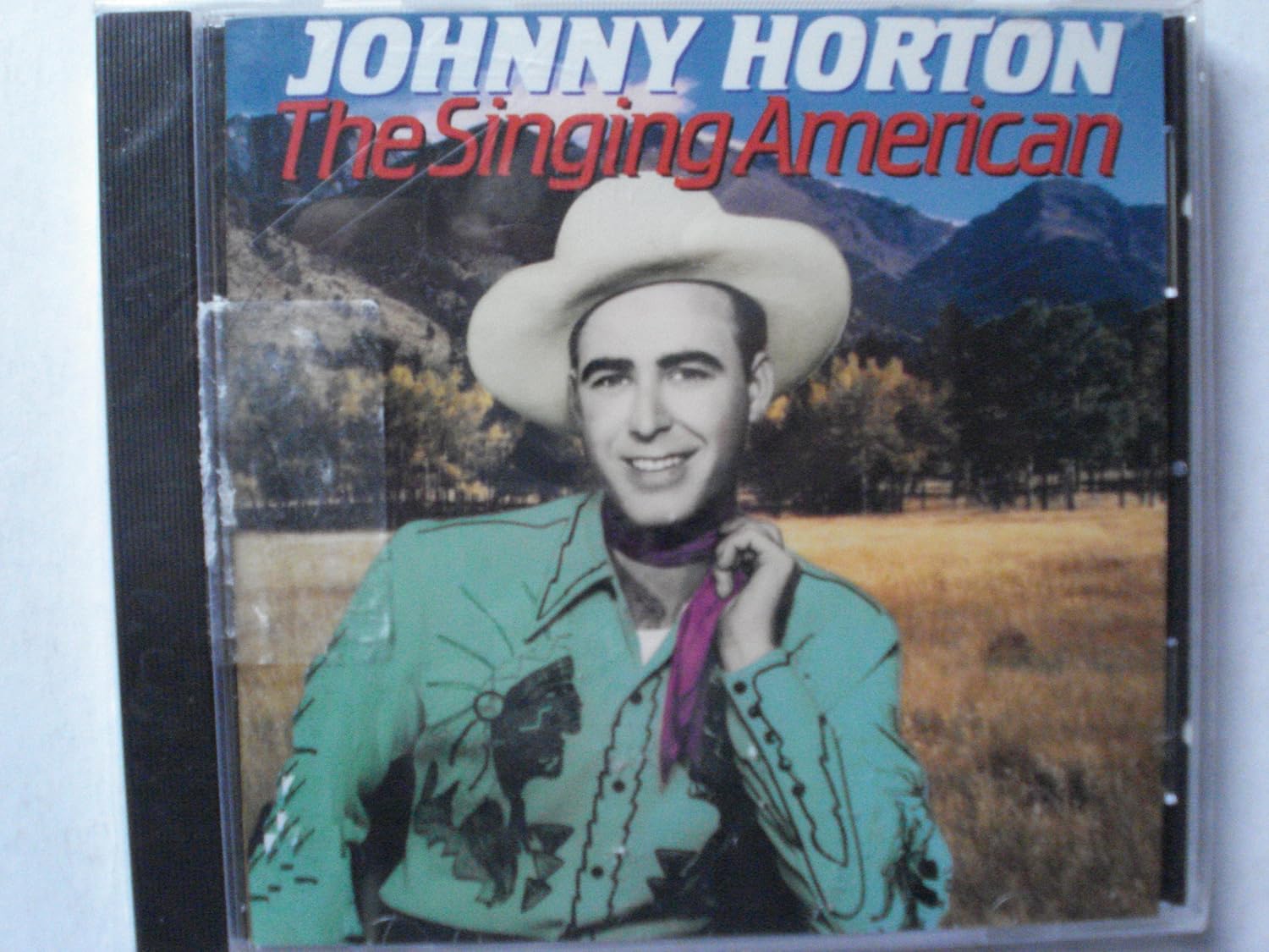 Amazon.com: The Singing American: 0079892261622: Johnny Horton: Books